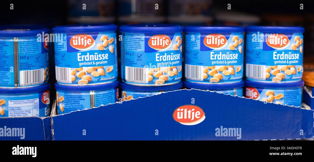 A visually appealing arrangement of roasted salted peanuts in blue ...