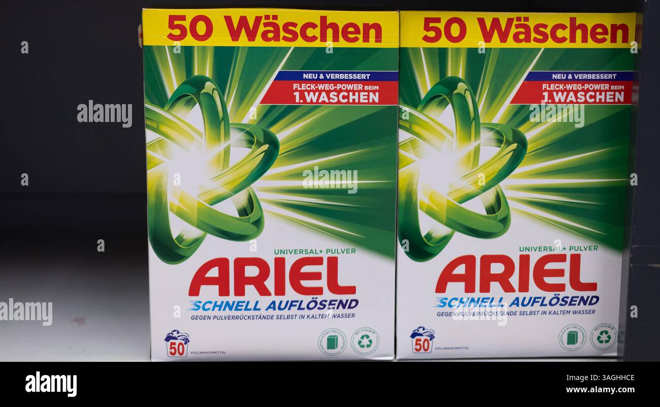 This image features a box of Ariel laundry powder prominently displayed ...