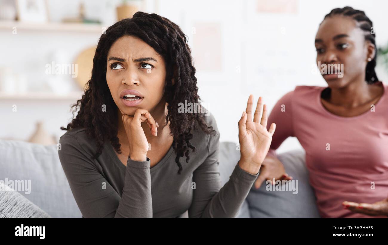 Two african american women fighting at home Stock Photo - Alamy
