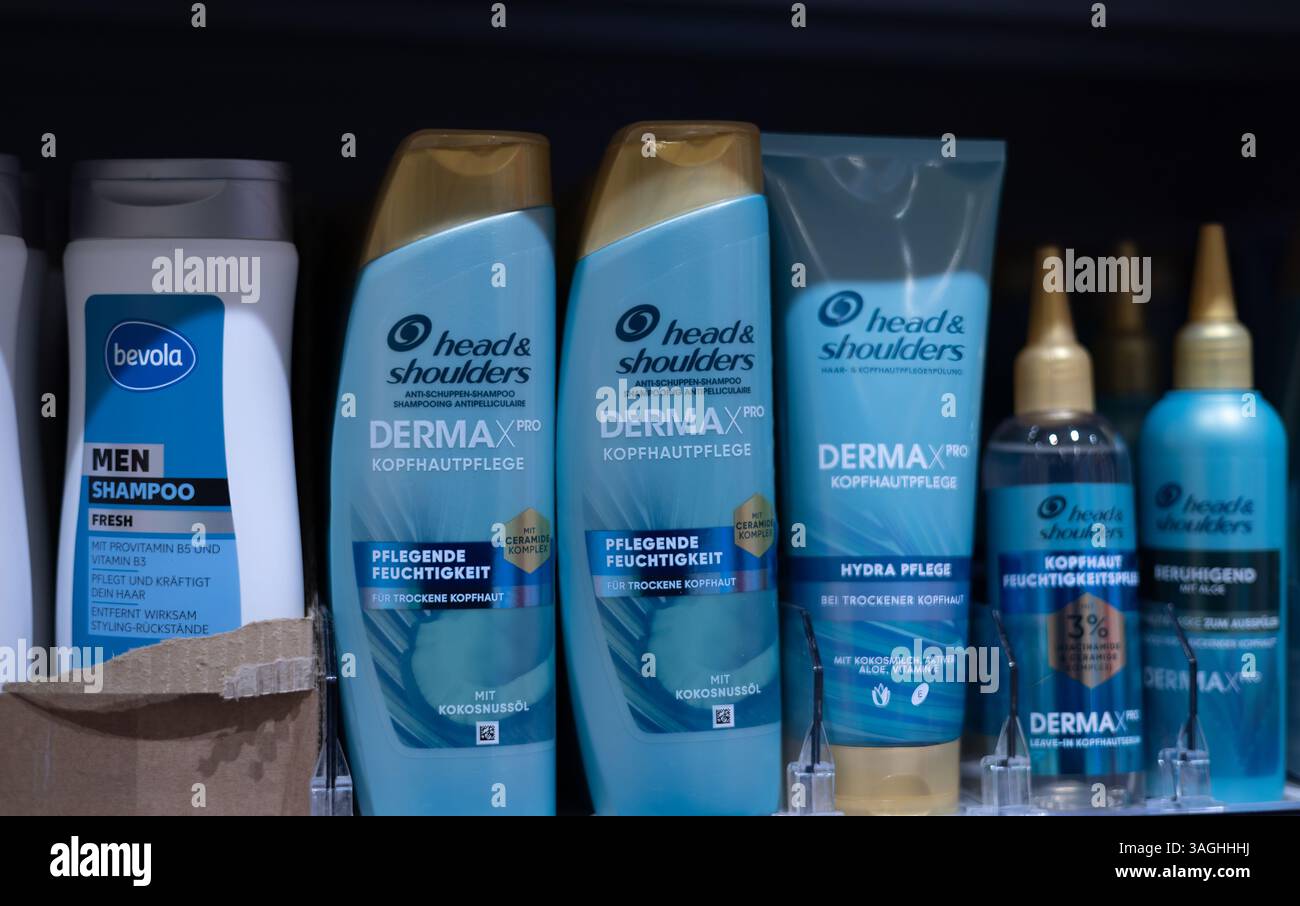 An assortment of Head and Shoulders anti-dandruff shampoos neatly ...