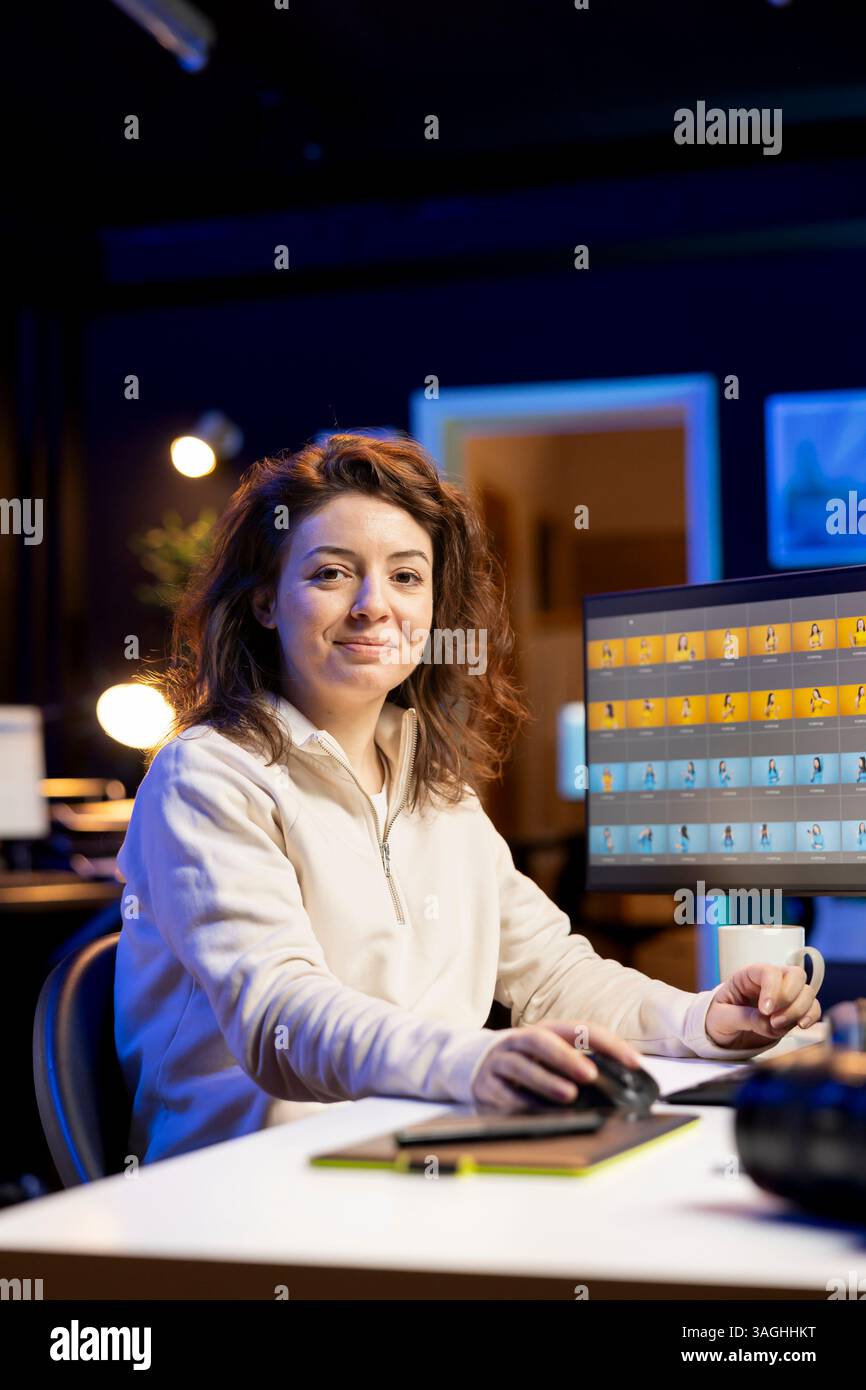 Portrait of cheerful photo editor retouching photographs with editing ...