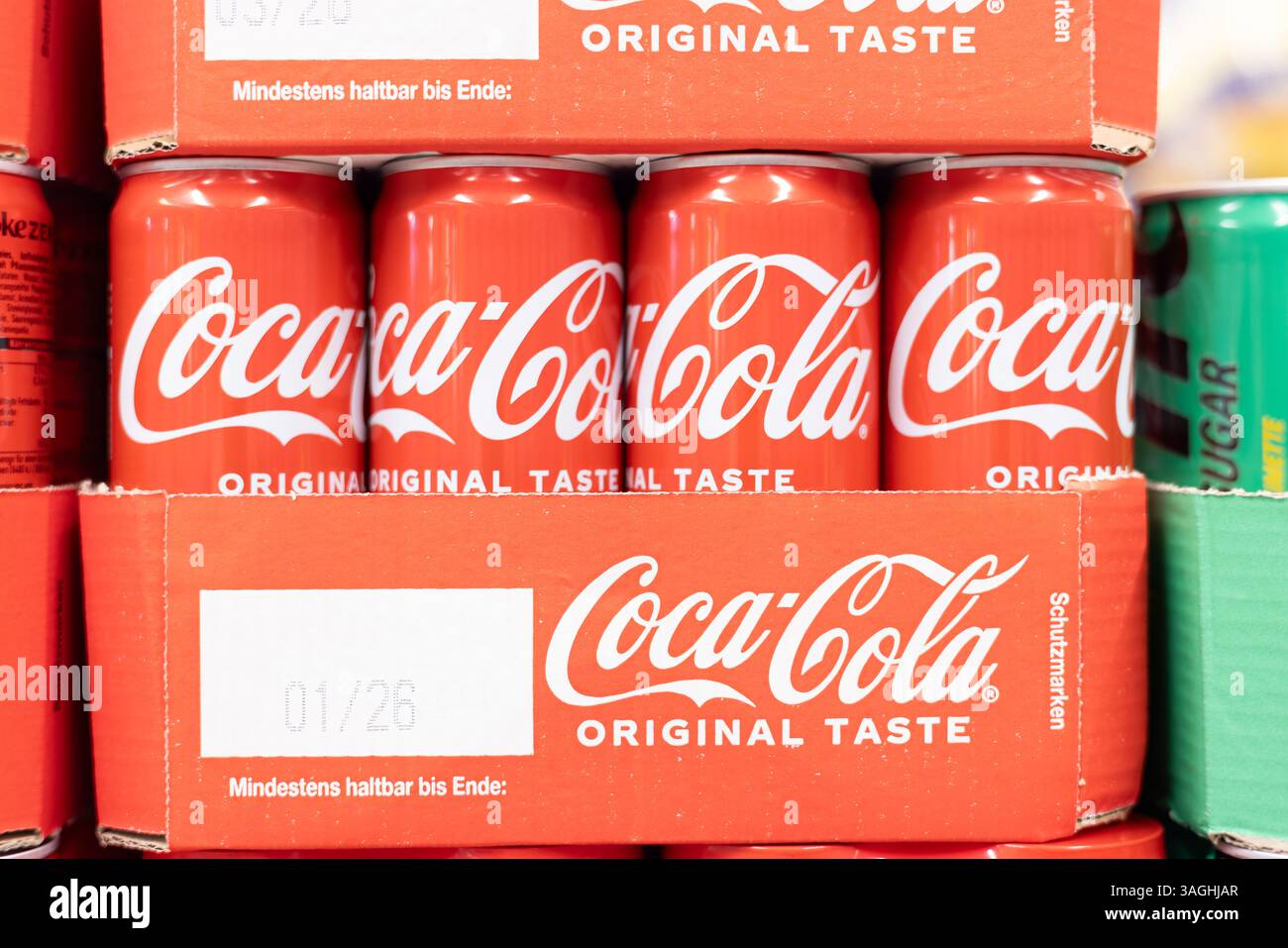 A neatly organized display of Coca-Cola cans, showcasing the iconic ...