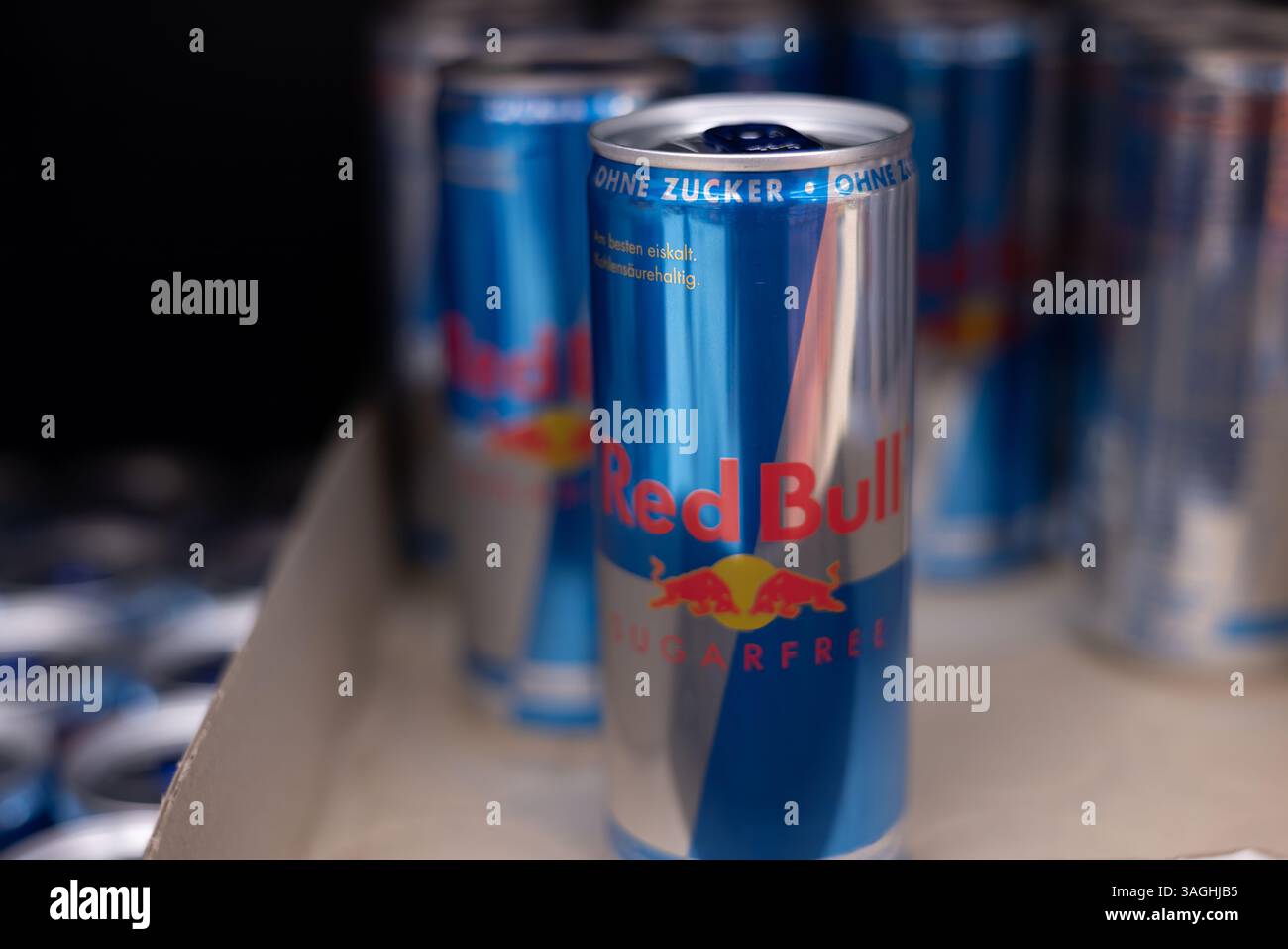 A collection of Red Bull energy drink cans stacked in a convenient ...