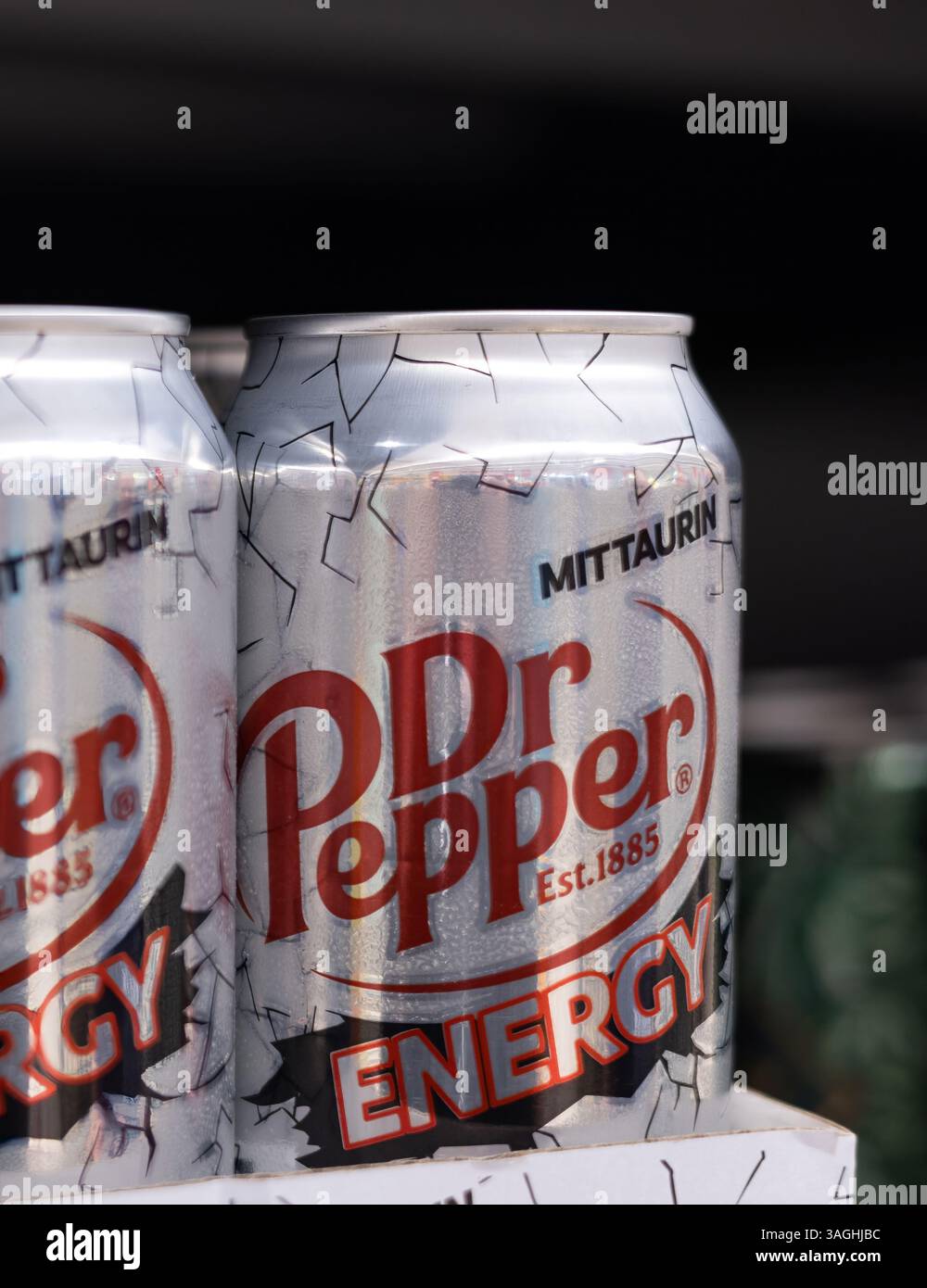A vibrant display of Dr. Pepper energy drink cans with a striking ...