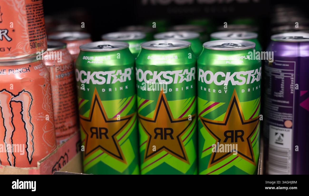 A vibrant display of Rockstar sour apple energy drink cans, emphasizing ...