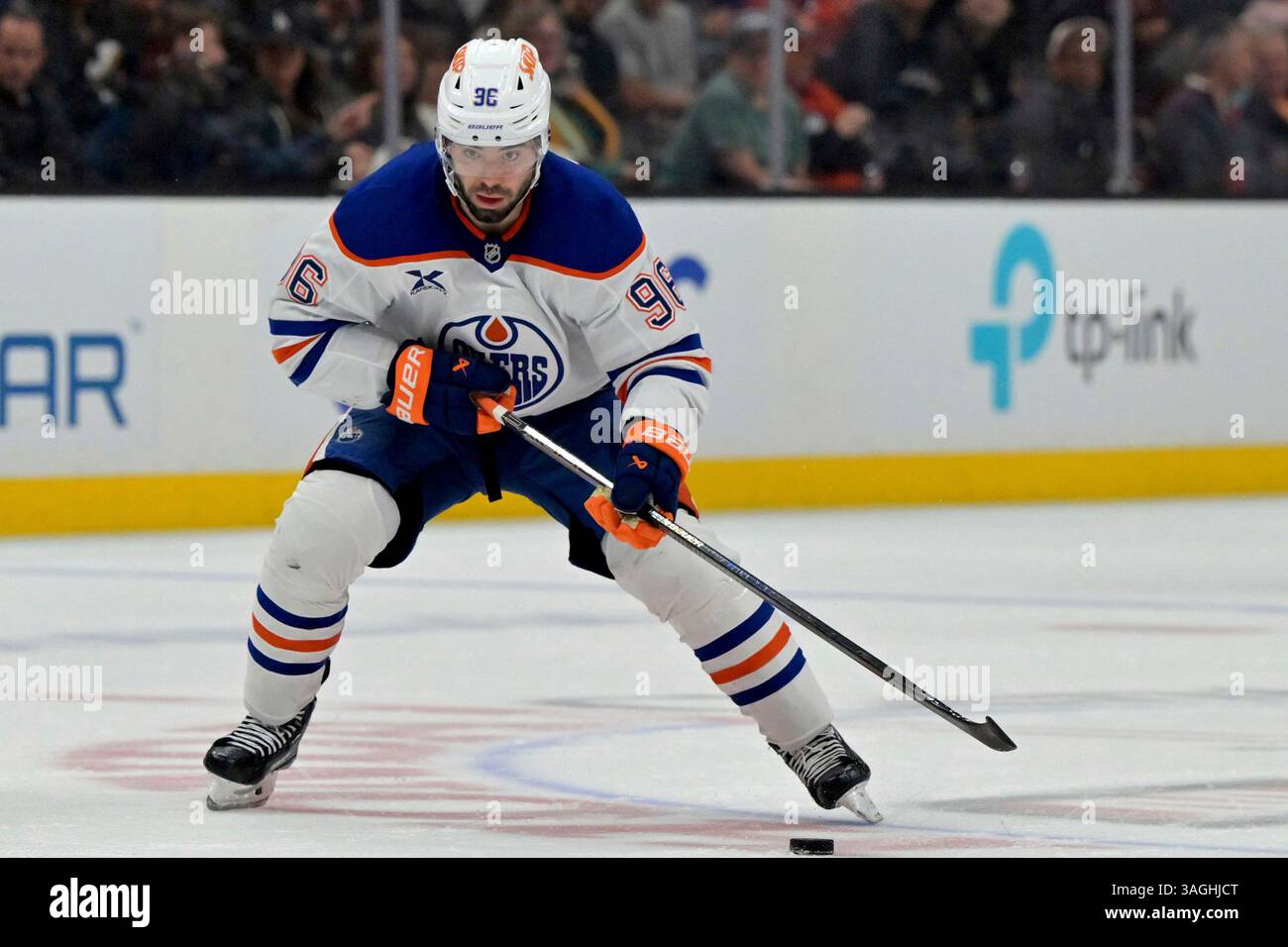 Edmonton Oilers defenseman Jake Walman controls the puck during an NHL ...