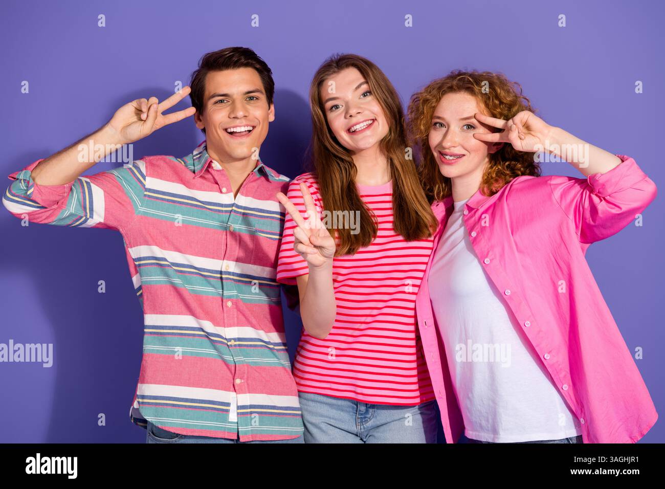 Group of cheerful young friends enjoying a fun moment together on a ...