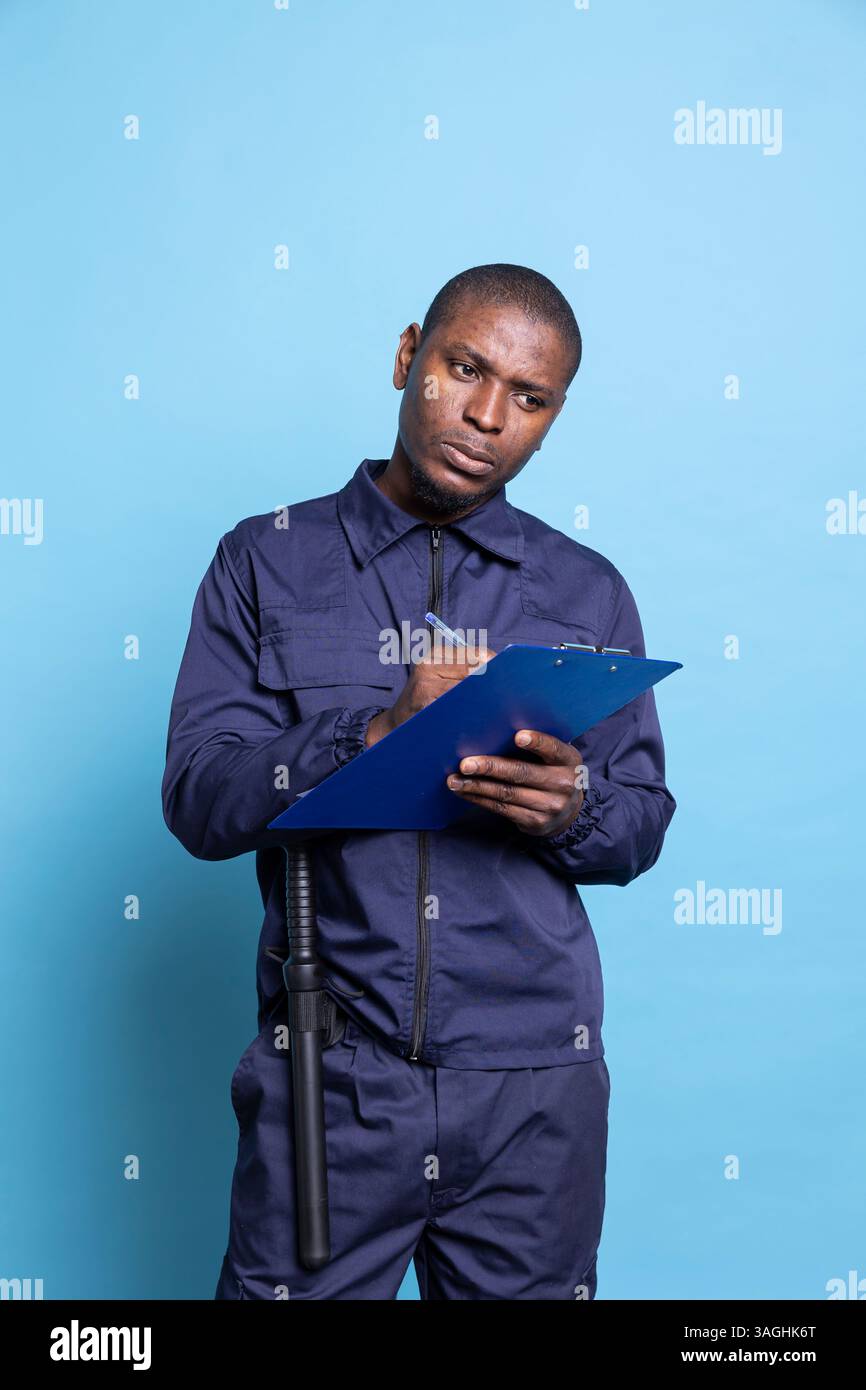 Security guard thinking of activities to write as his responsibility ...