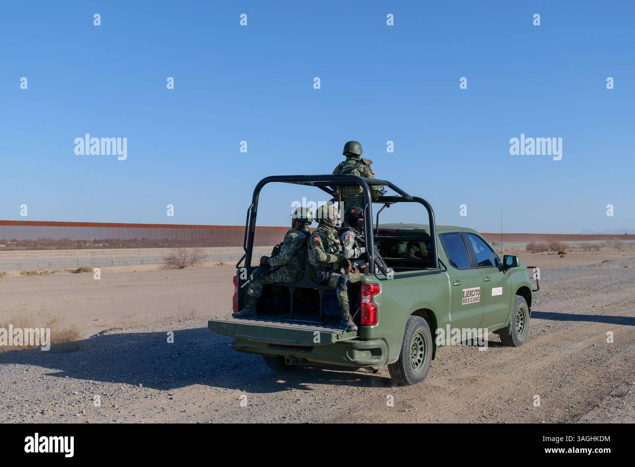Mexican military and National Guard patrol near the US border wall in ...