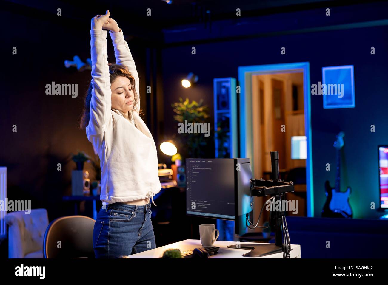Computer scientist doing software quality assurance, stretching after reading source code ...