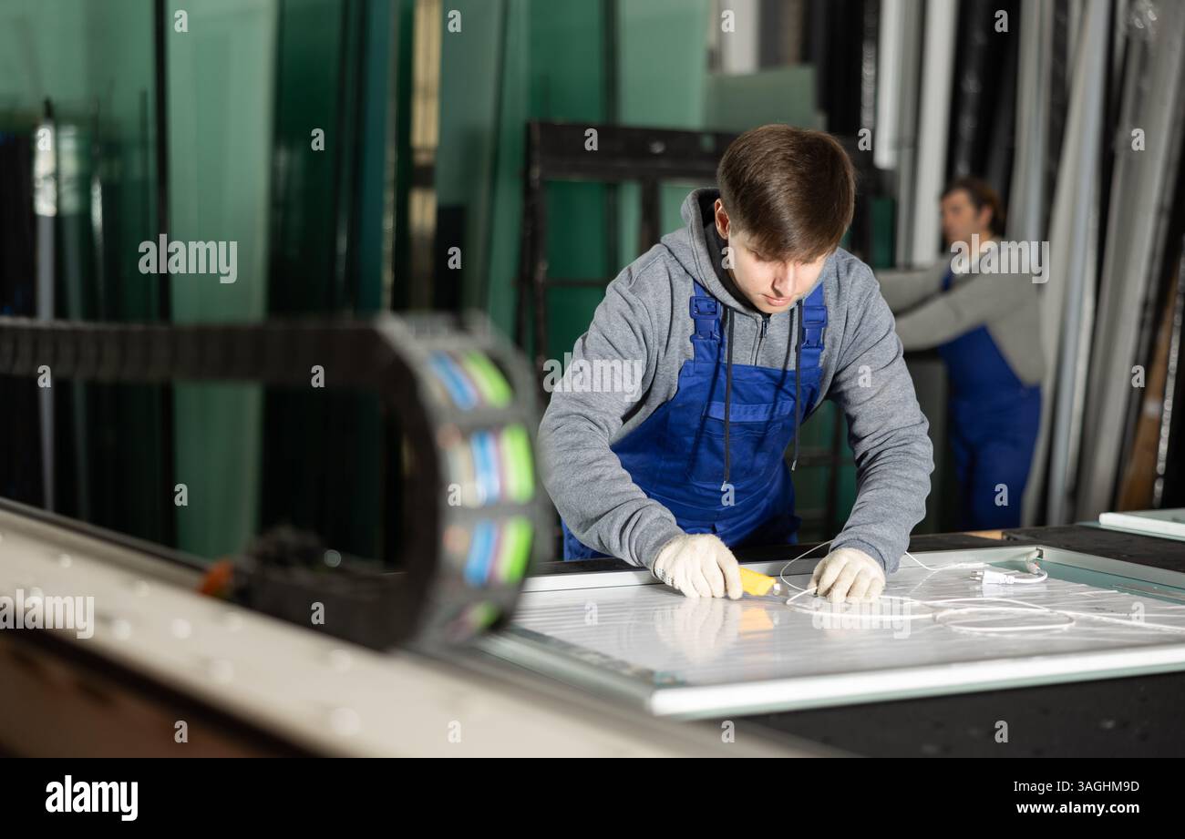 Young guy cutting sheet hi-res stock photography and images - Alamy