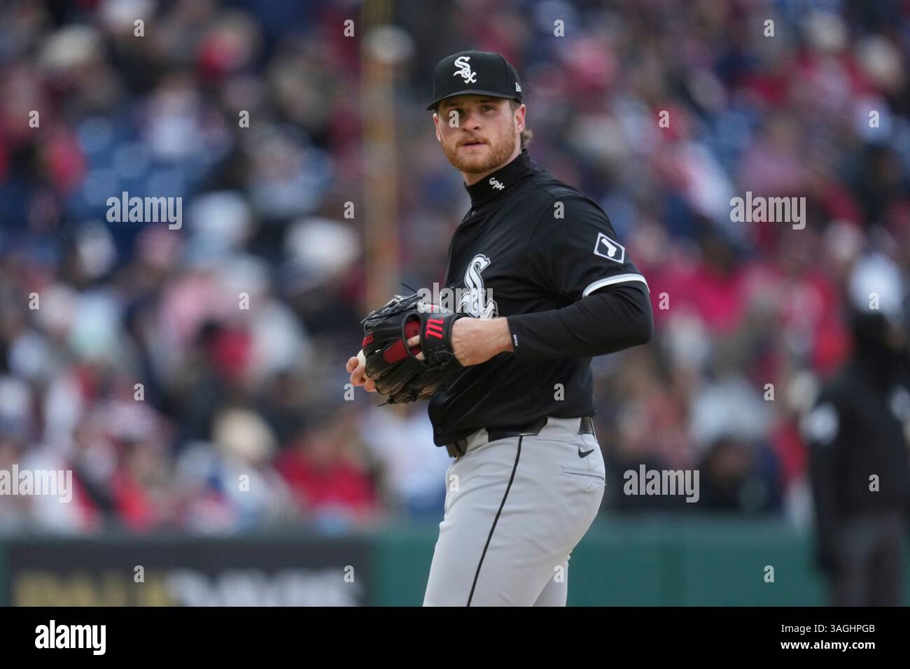 Chicago White Sox pitcher Shane Smith looks to first base and Cleveland ...