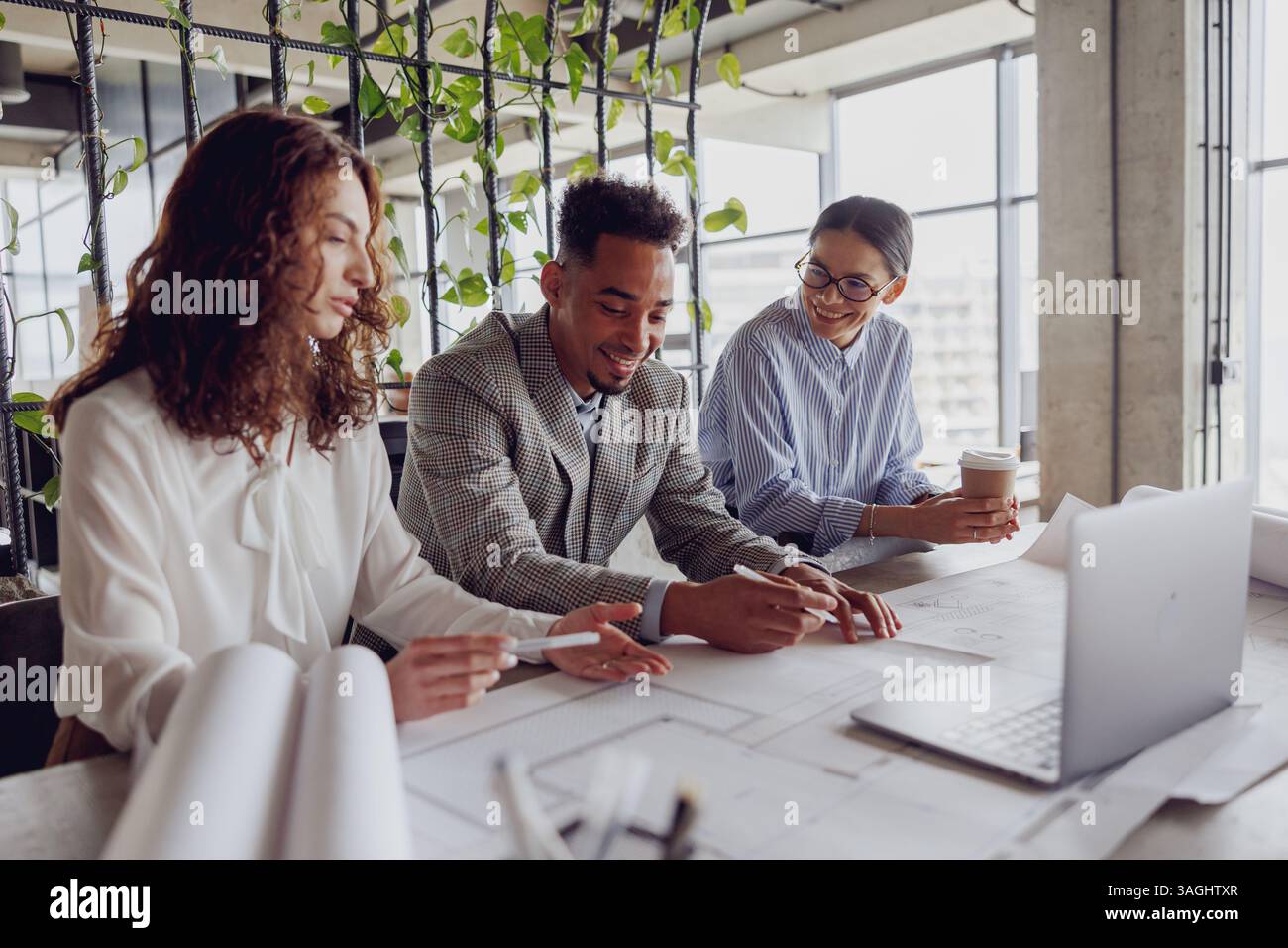 Engaging Collaborative Team Meeting Taking Place in a Modern and ...