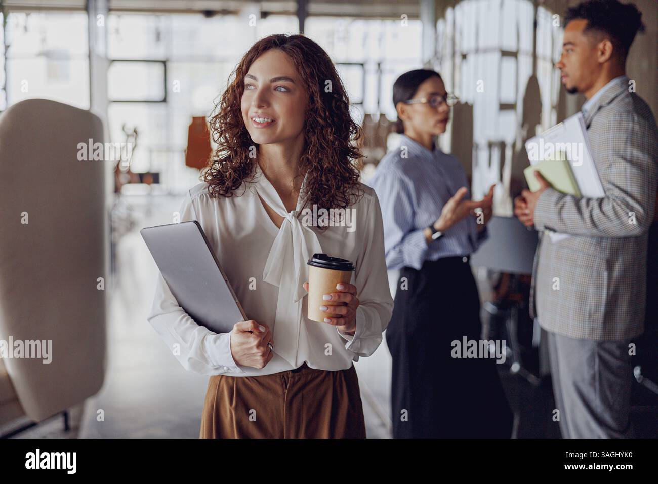 Engaging in Professional Networking Activities Within a Modern Office ...