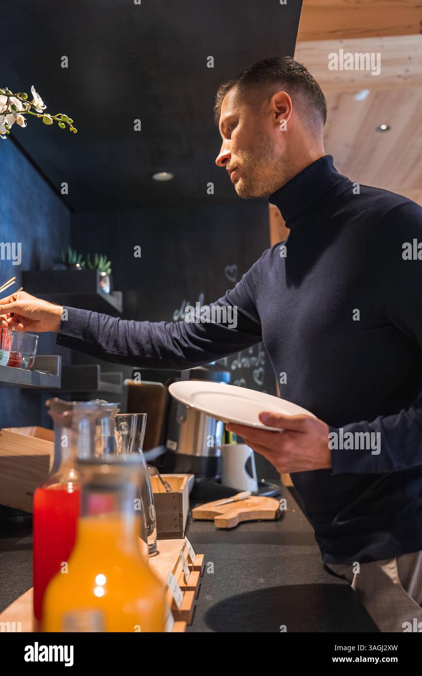 Man Serving at Breakfast Buffet in Modern Luxury Hotel Dining Area ...