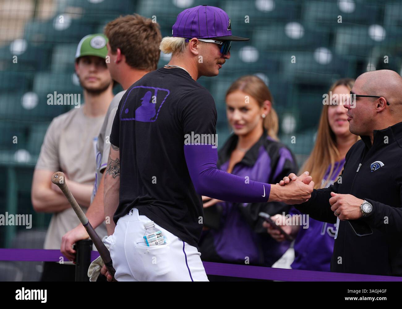 Colorado Rockies right field prospect Zac Veen, left, greets family ...