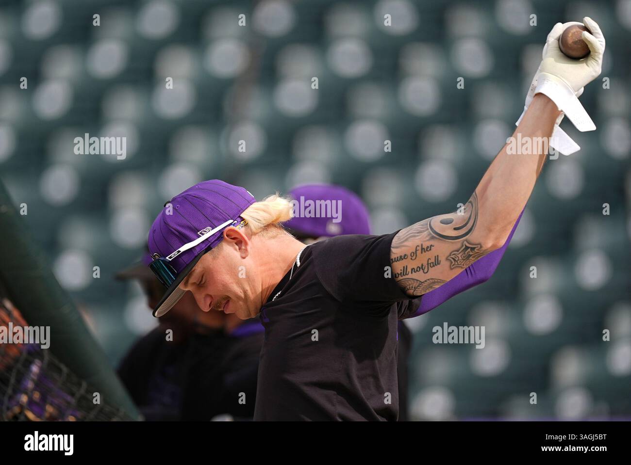 Colorado Rockies right field prospect Zac Veen warms up before ...