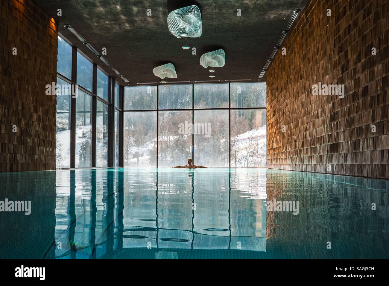 Indoor Infinity Pool with Mountain Views in Italian Alps Hotel Stock ...