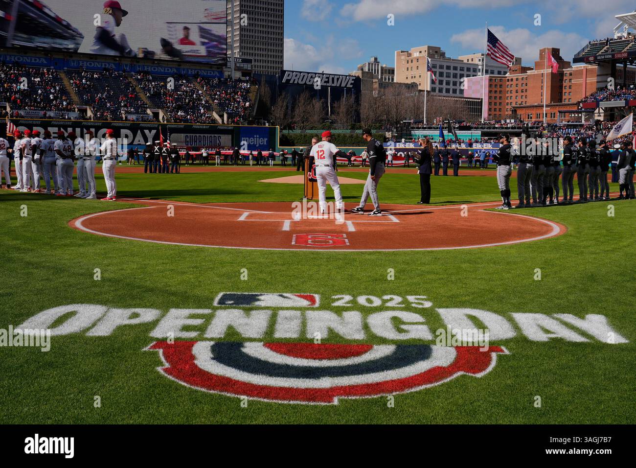 Cleveland Guardians manager Stephen Vogt (12) greets Chicago White Sox ...