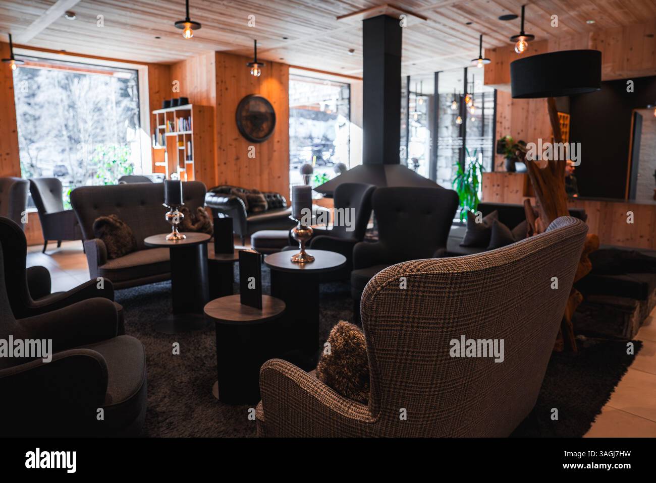 Modern Alpine Hotel Lounge with Fireplace and Snowy Views Stock Photo ...