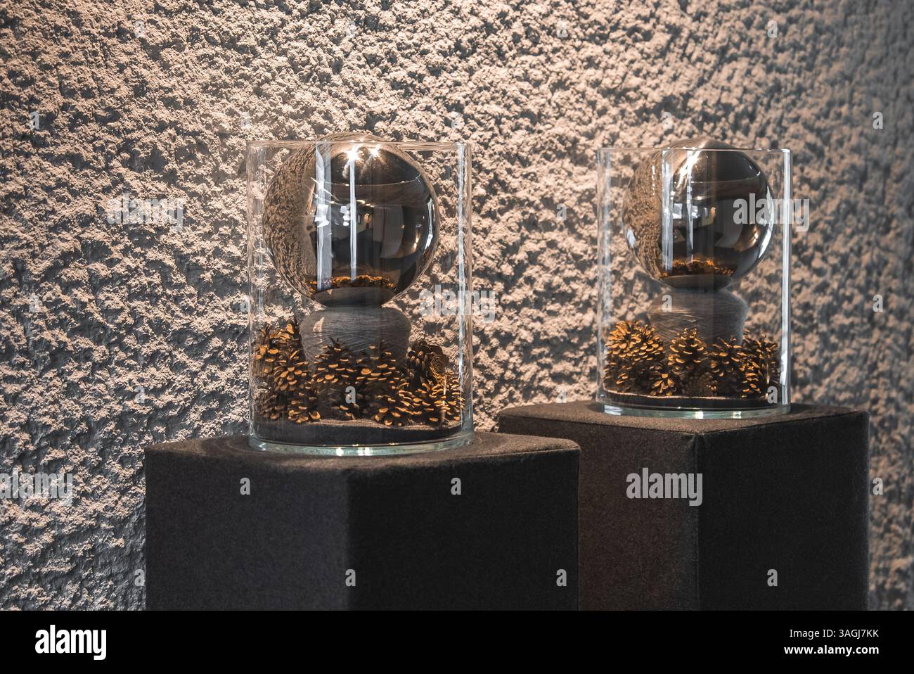 Decorative Glass Containers with Metallic Spheres and Pinecones Stock ...
