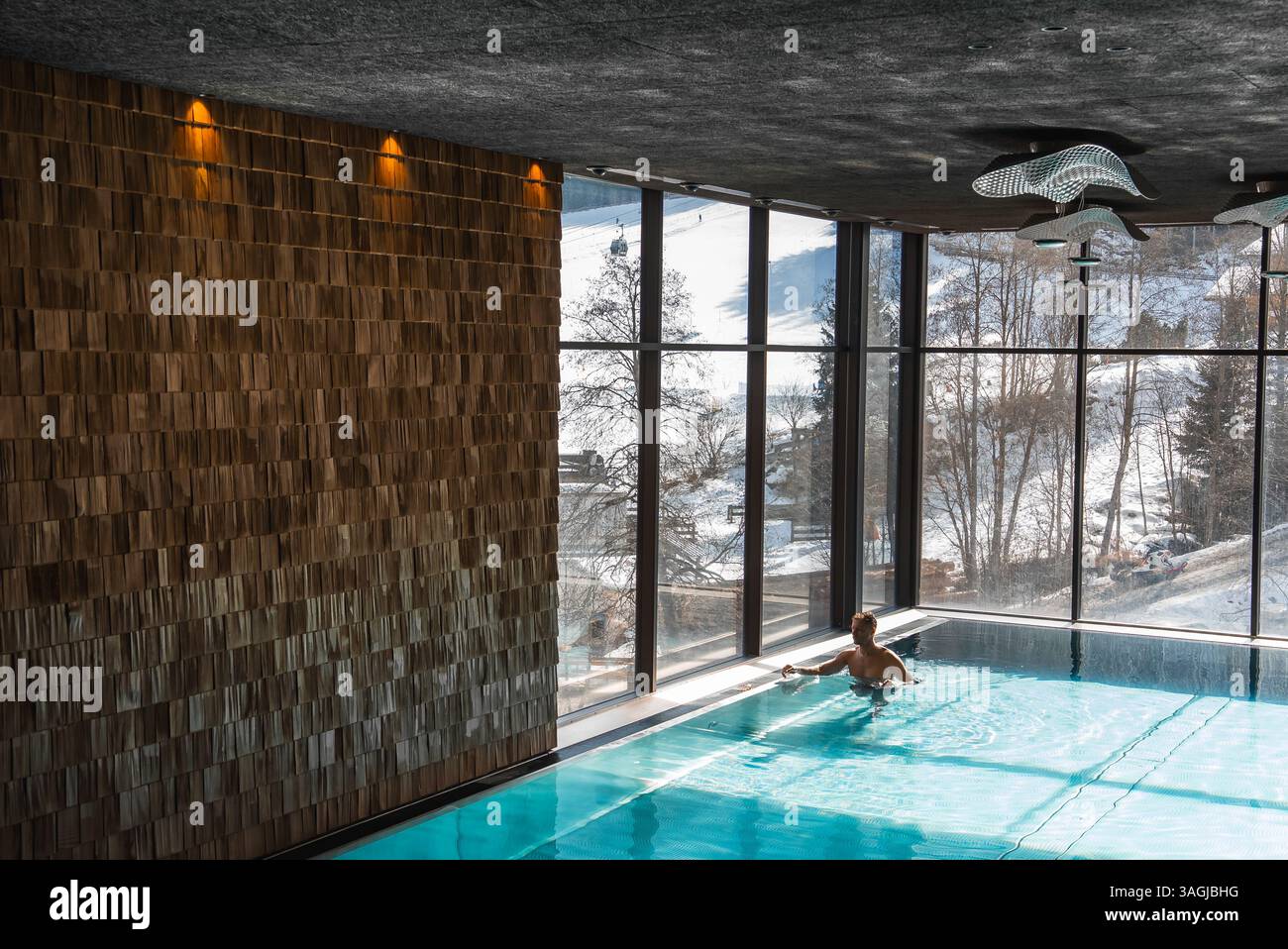 Indoor Pool with Panoramic Windows Overlooking Snowy Italian Alps Stock ...
