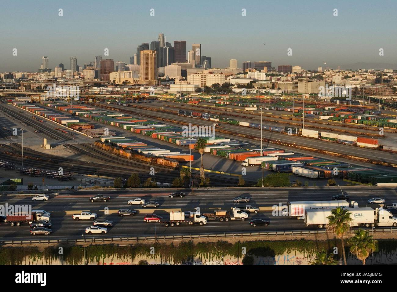 Traffic flows on Interstate 5 past shipping containers near downtown ...
