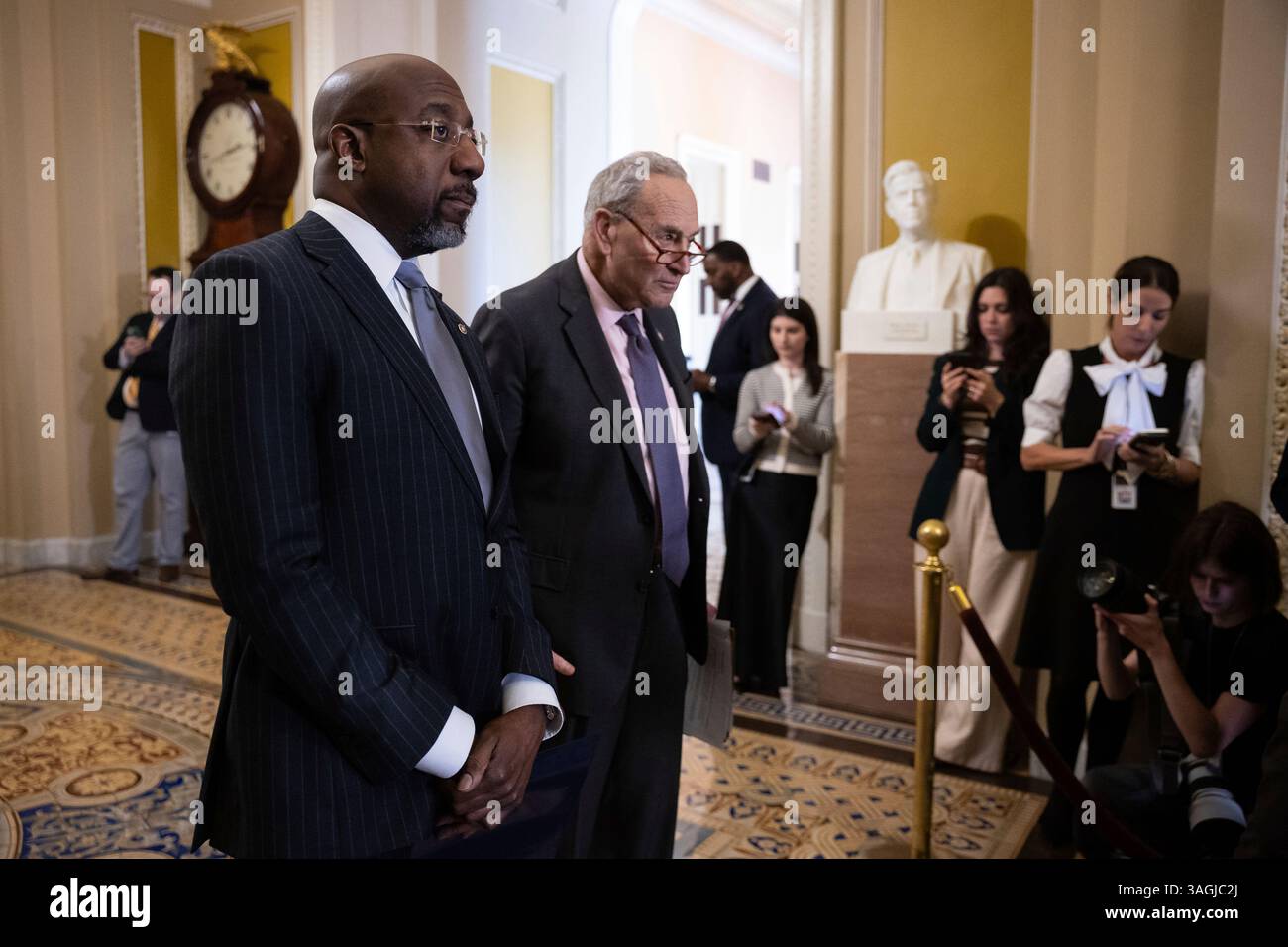 Sen. Raphael Warnock (D-Ga.) and Senate Minority Leader Chuck Schumer ...