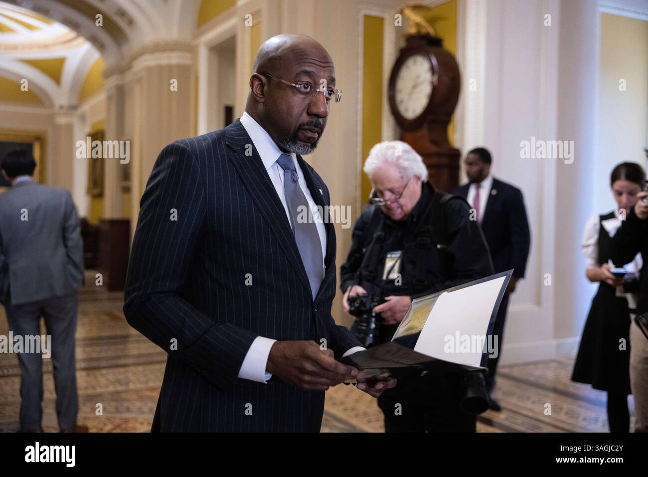 Sen. Raphael Warnock (D-Ga.) arrives for a press conference at the U.S ...