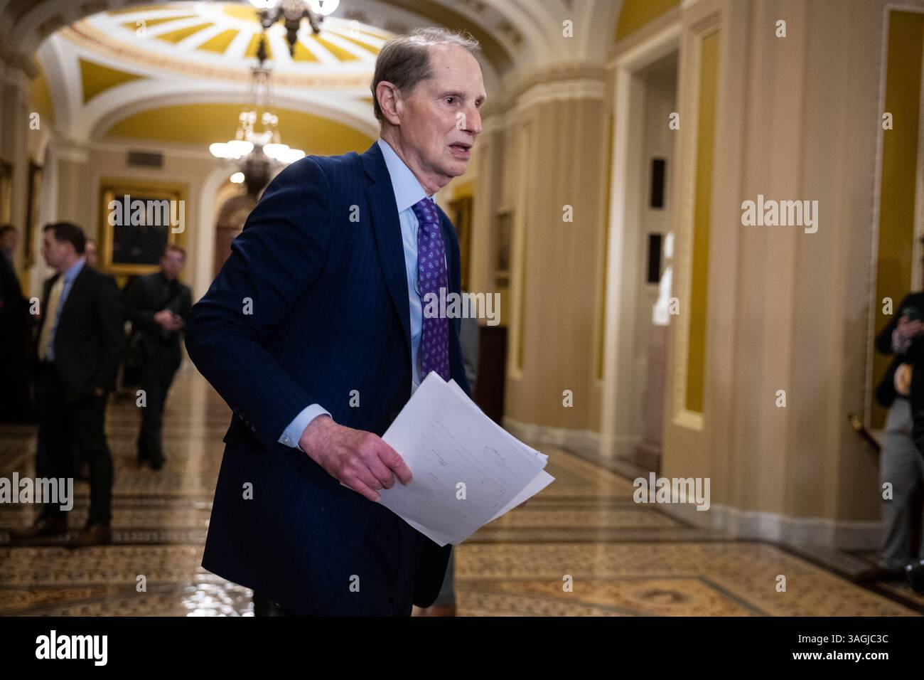 Sen. Ron Wyden (D-Ore.) arrives for a press conference at the U.S ...