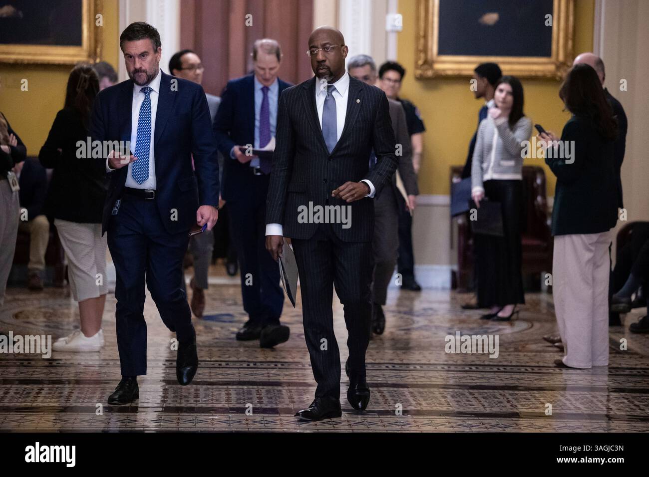 Sen. Raphael Warnock (D-Ga.) arrives for a press conference at the U.S ...