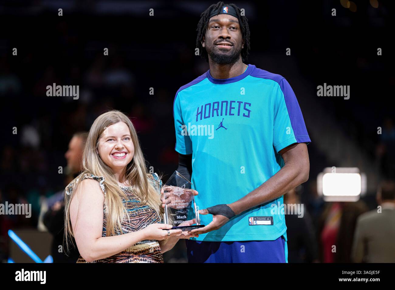 Charlotte Hornets center Mark Williams (5) is honored with the Rick ...
