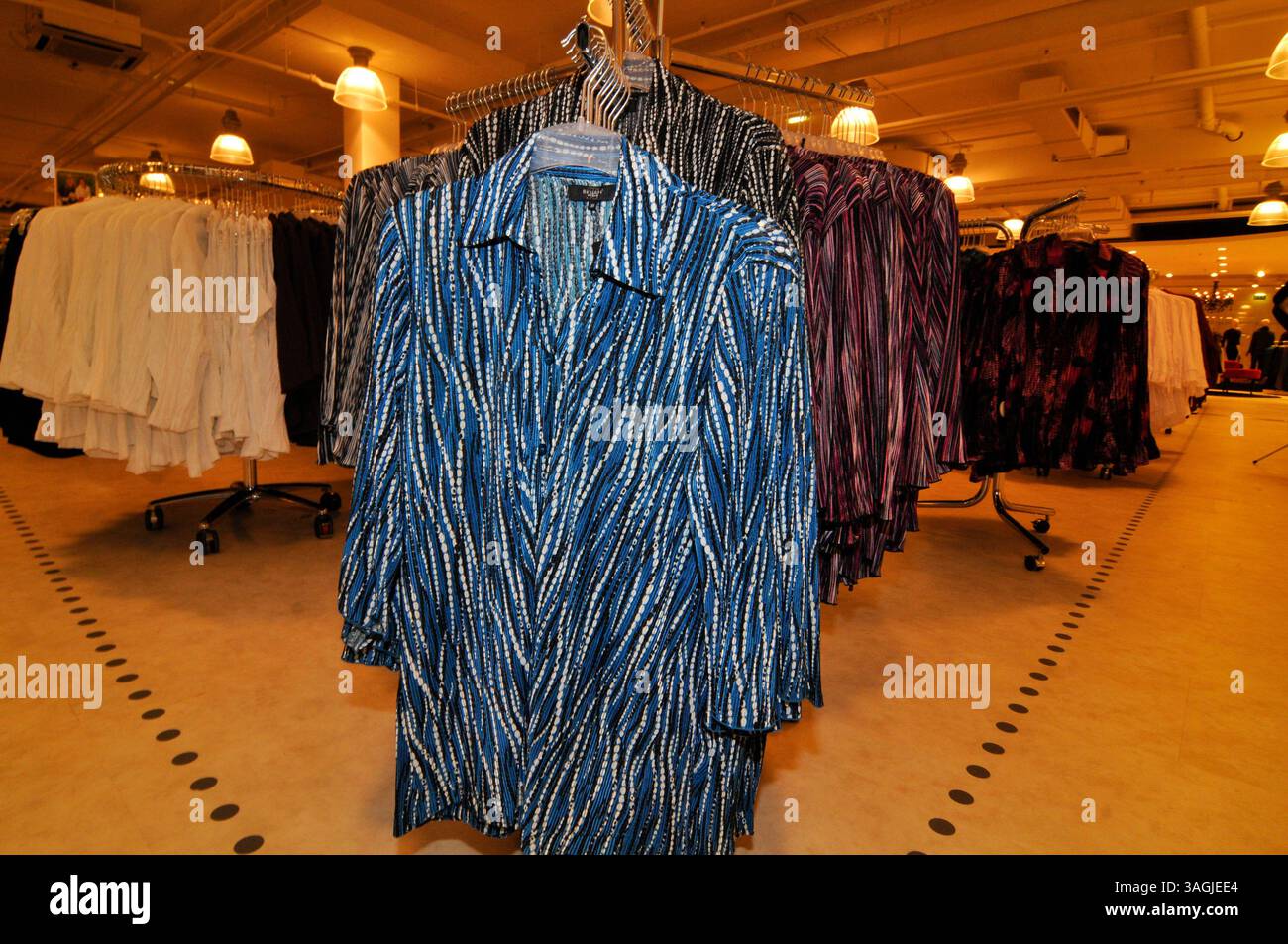 shirts in a clothing store, textile design and fashion trends shirts in ...