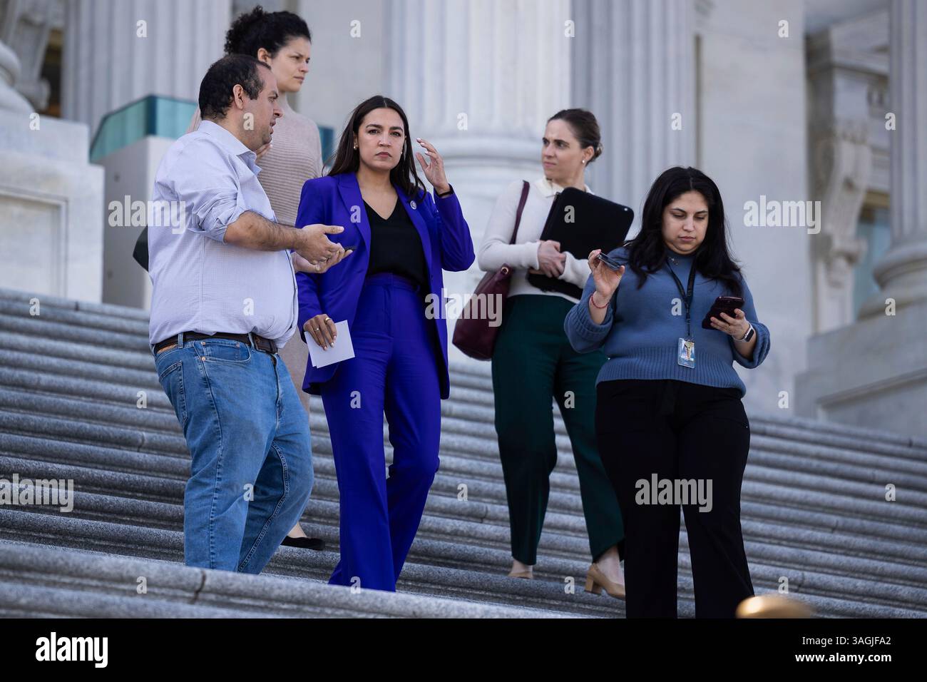 Rep. Alexandria Ocasio-Cortez (D-N.Y.) speaks with reporters as she ...