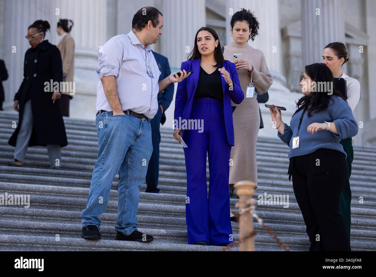 Rep. Alexandria Ocasio-Cortez (D-N.Y.) speaks with reporters as she ...