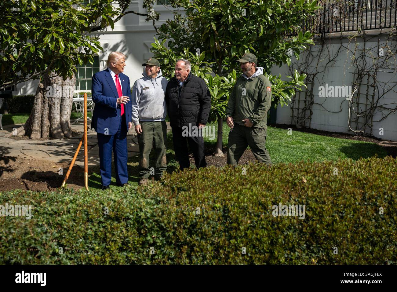 President Donald Trump participates in a commemorative tree-planting ...