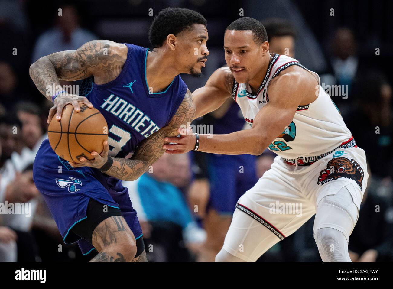 Memphis Grizzlies guard Desmond Bane (22) guards Charlotte Hornets ...