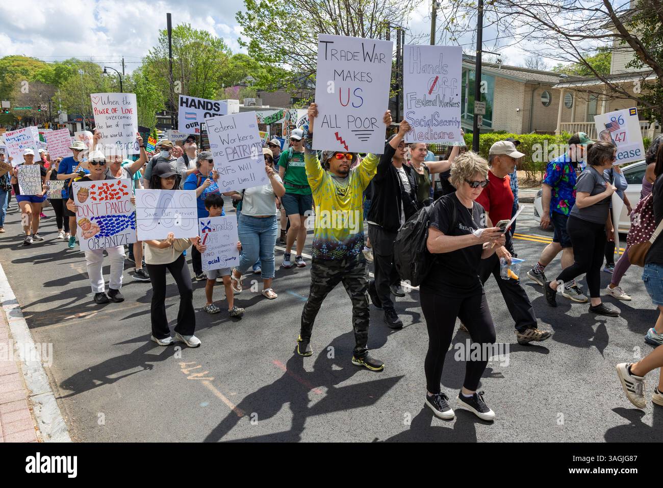 Atlanta, GA / USA - April 5, 2025: Thousands of people march holding ...