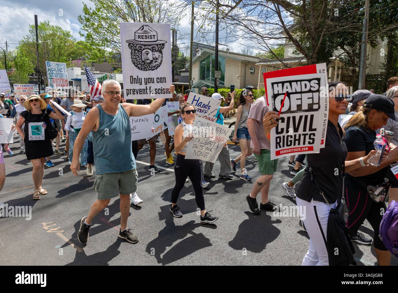 Atlanta, GA / USA - April 5, 2025: Thousands of people march holding ...