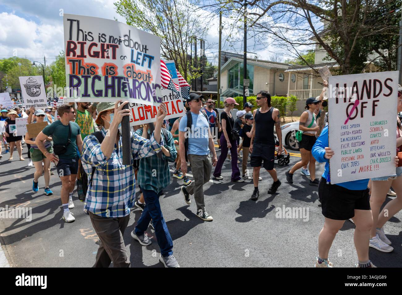 Atlanta, GA / USA - April 5, 2025: Thousands of people march holding ...