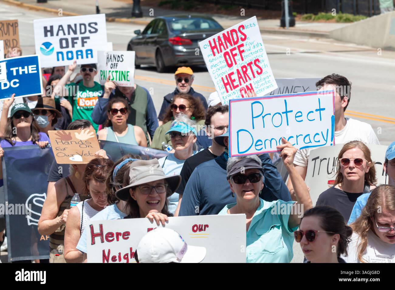 Atlanta, GA / USA - April 5, 2025: People march down Peachtree Street ...