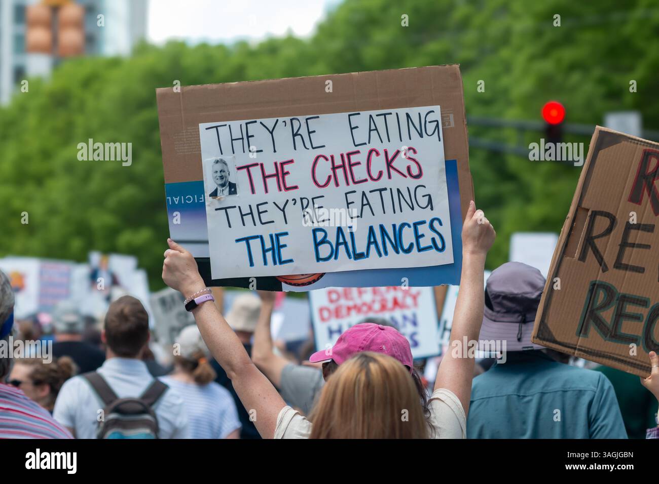 Atlanta, GA / USA - April 5, 2025: Protestor holds sign referencing ...