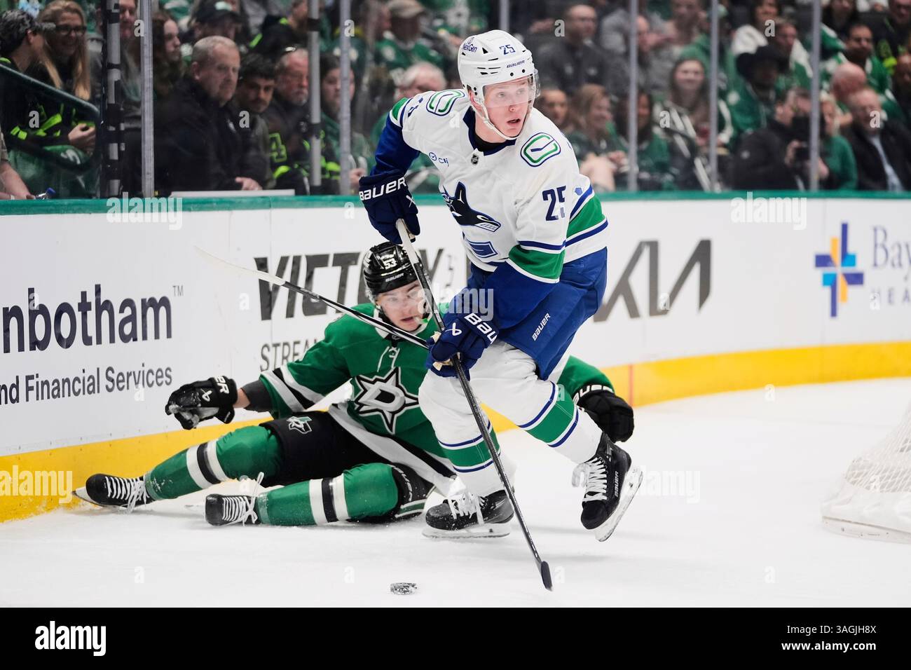 Vancouver Canucks defenseman Elias N. Pettersson (25) takes control of ...