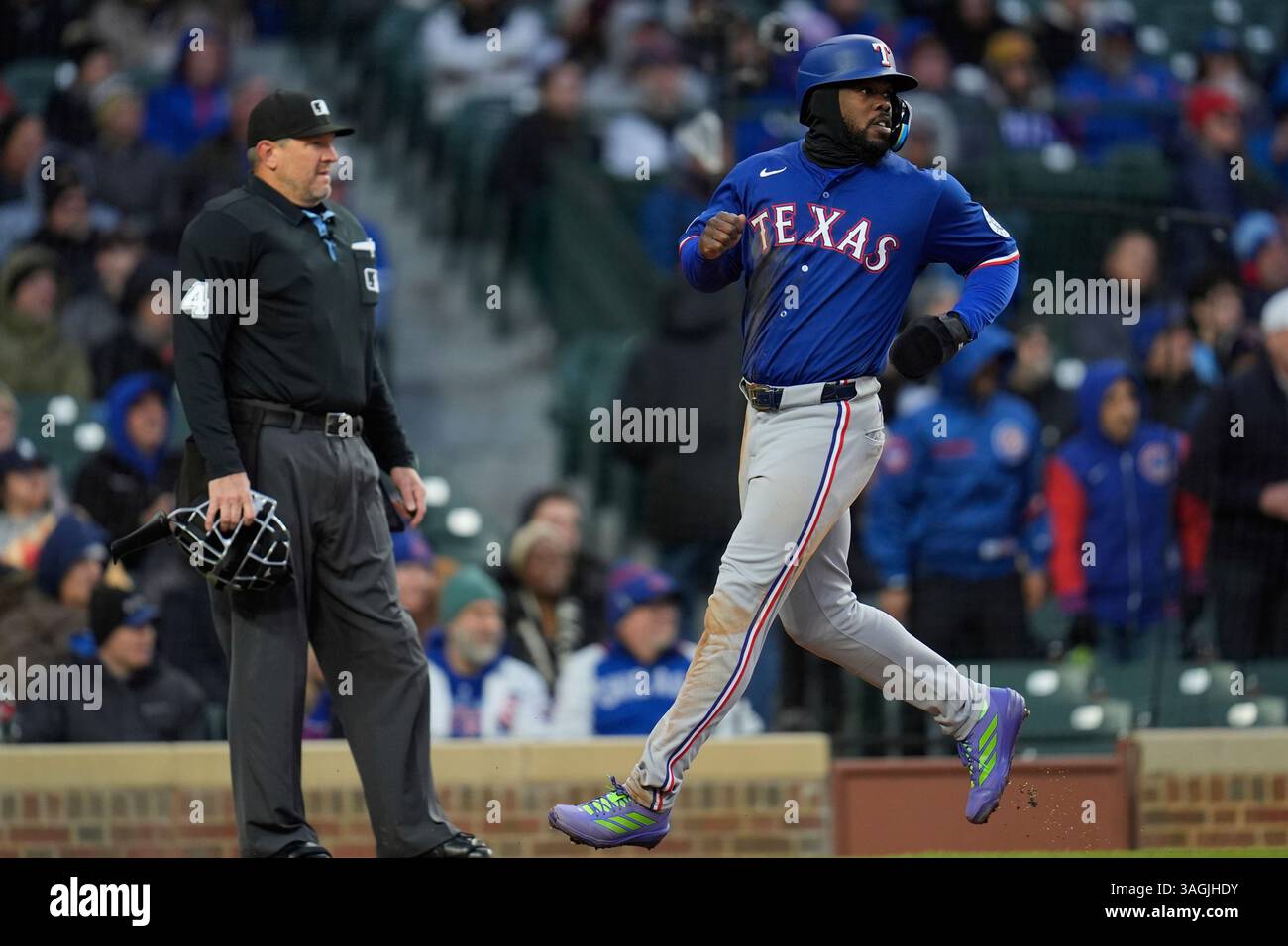Texas Rangers' Adolis García (53) scores on a single from Jonah Heim ...