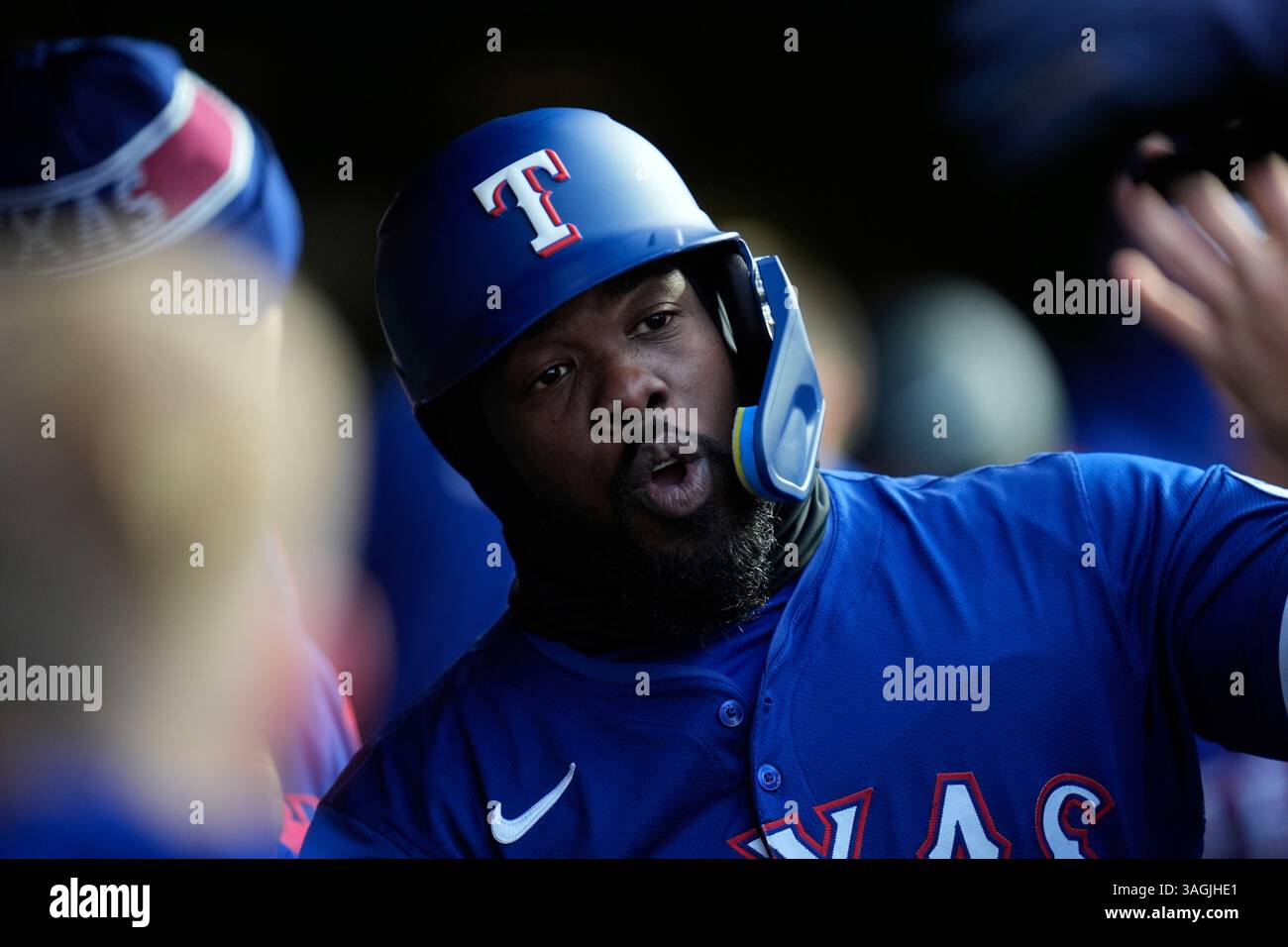 Texas Rangers' Adolis García (53) celebrates after scoring on a single ...