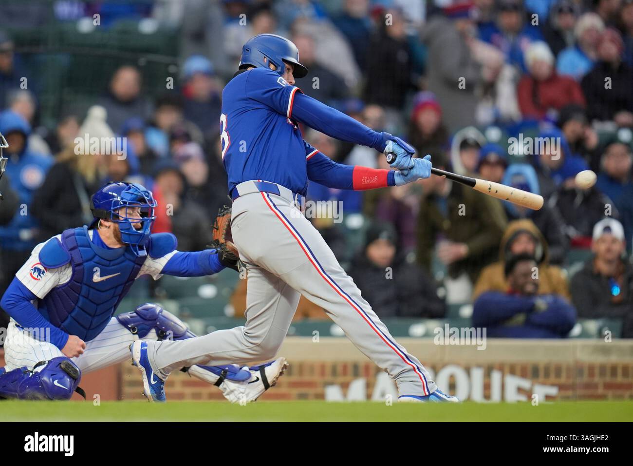Texas Rangers' Jonah Heim (28) hits a two-run single during the second ...