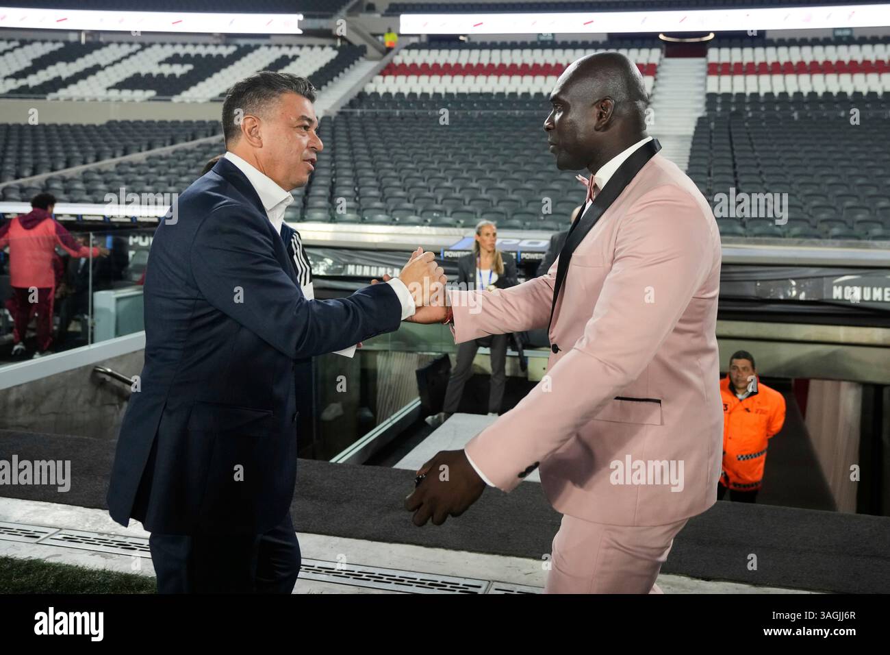 Coach Marcelo Gallardo of Argentina's River Plate, left, shakes hands ...