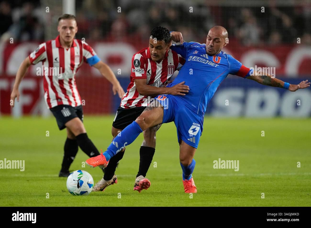 Tiago Palacios of Argentina's Estudiantes de La Plata, center, and ...