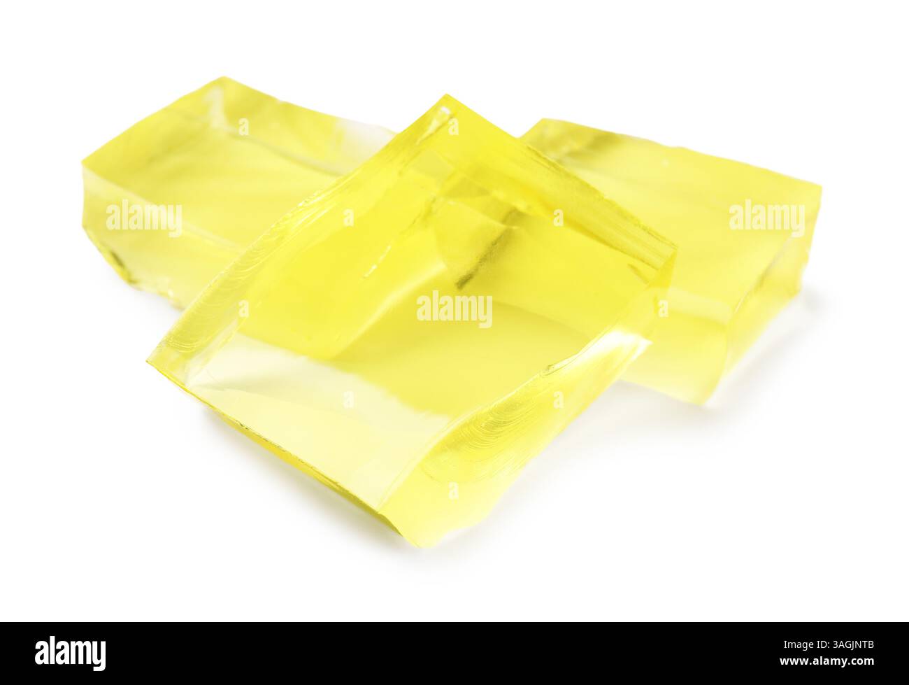 Tasty yellow jelly cubes isolated on white Stock Photo - Alamy