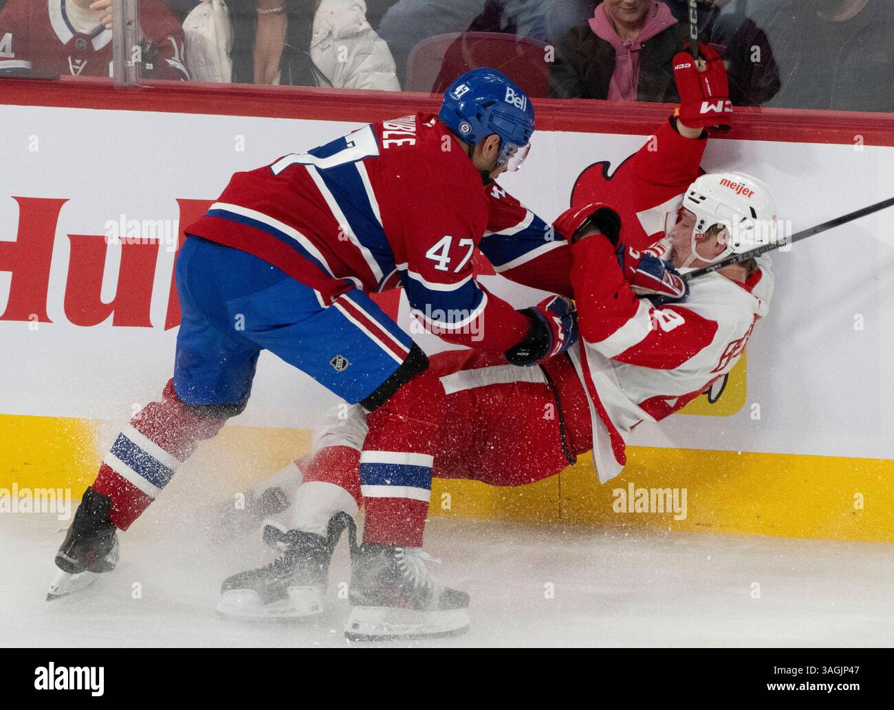 Montreal Canadiens' Jayden Struble (47) checks Detroit Red Wings ...